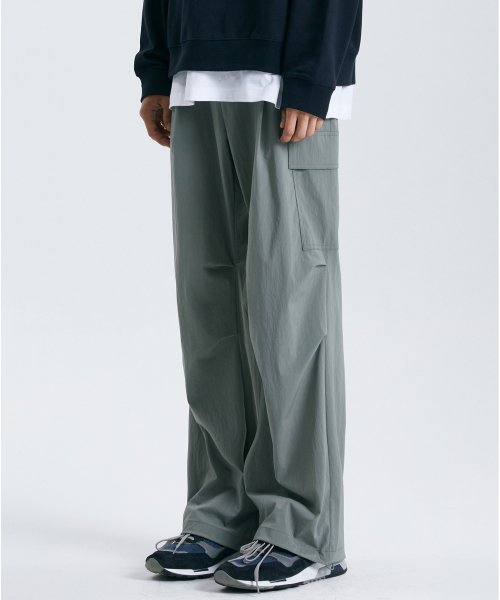 MUSINSA | TNGT Khaki Wide Fit Nylon Parachute String Cargo Pants (TNPA3F105K2)