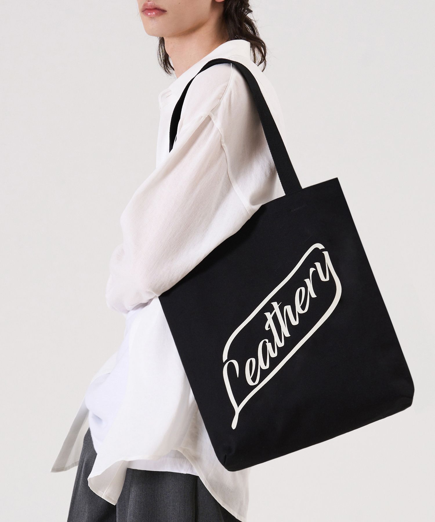 MUSINSA | LEATHERY Cursive Logo Eco Bag [BLACK]