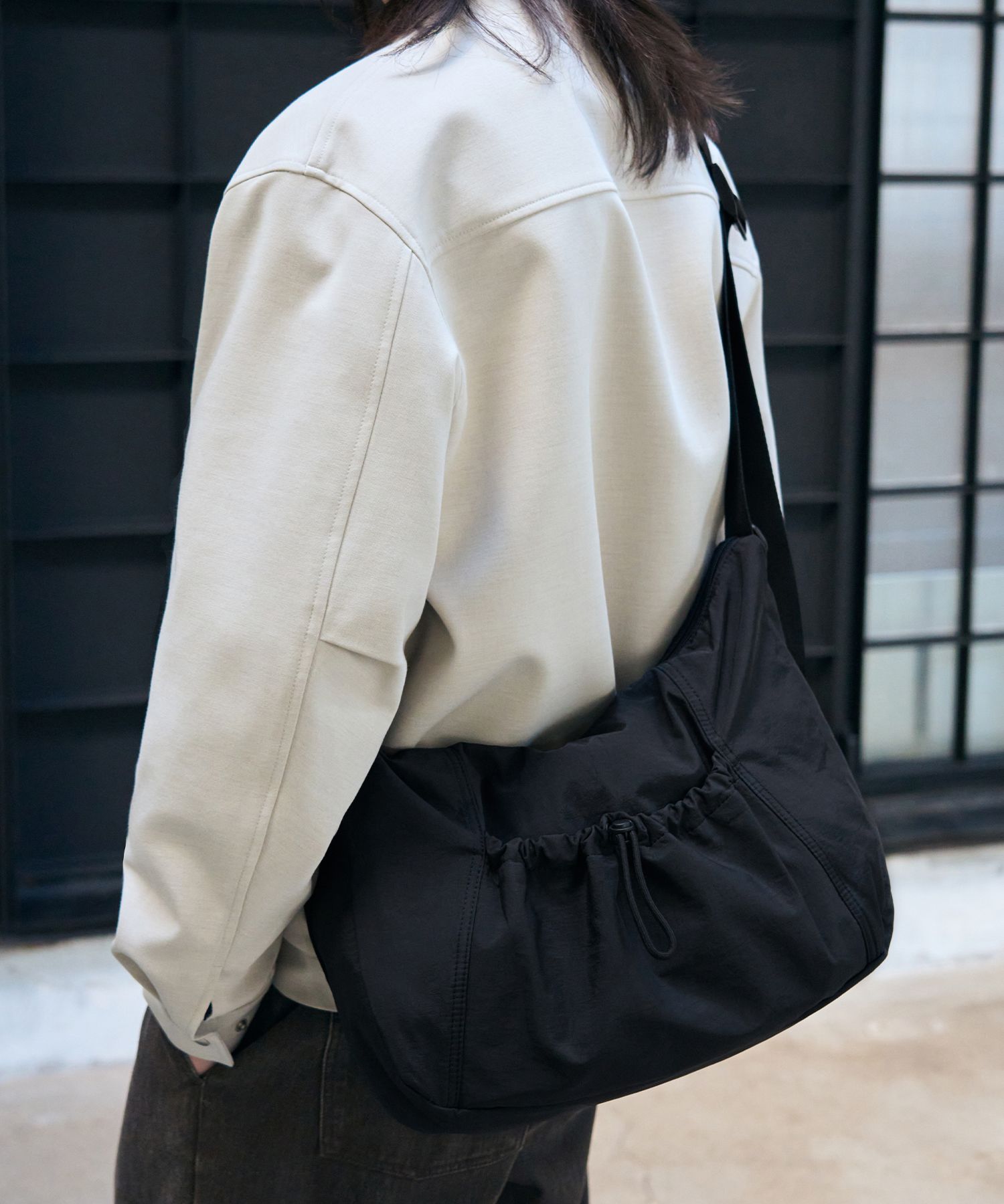 MUSINSA | DRAW FIT Shift string nylon cross bag [BLACK]