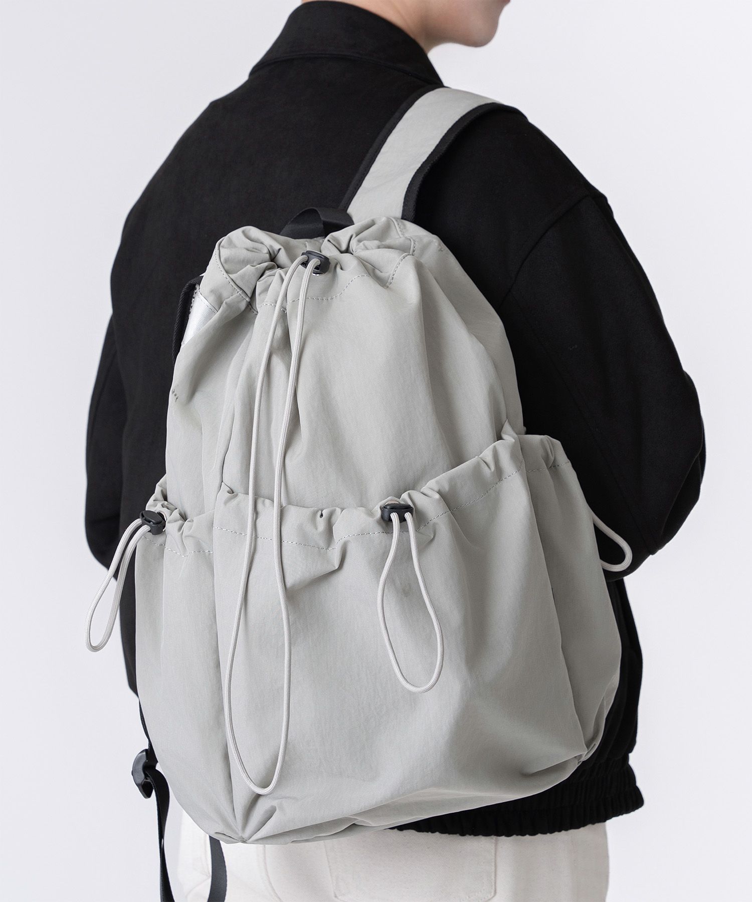 MUSINSA | UNDEROFF Nylon String Backpack Grey