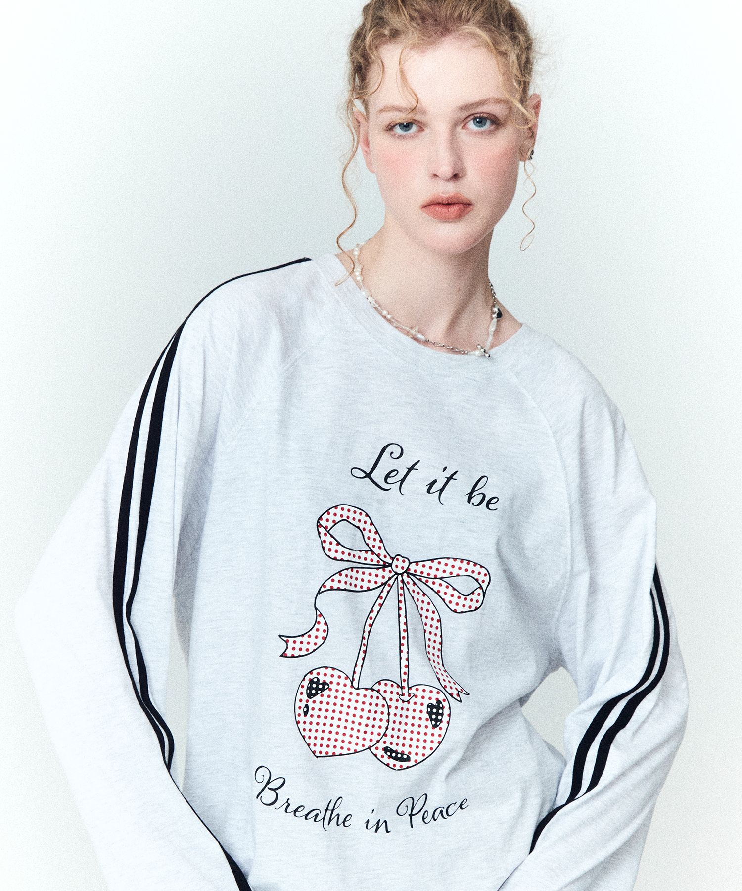 MUSINSA | CPGN STUDIO Ribbon Cherry Track Raglan Long Sleeve Melange White