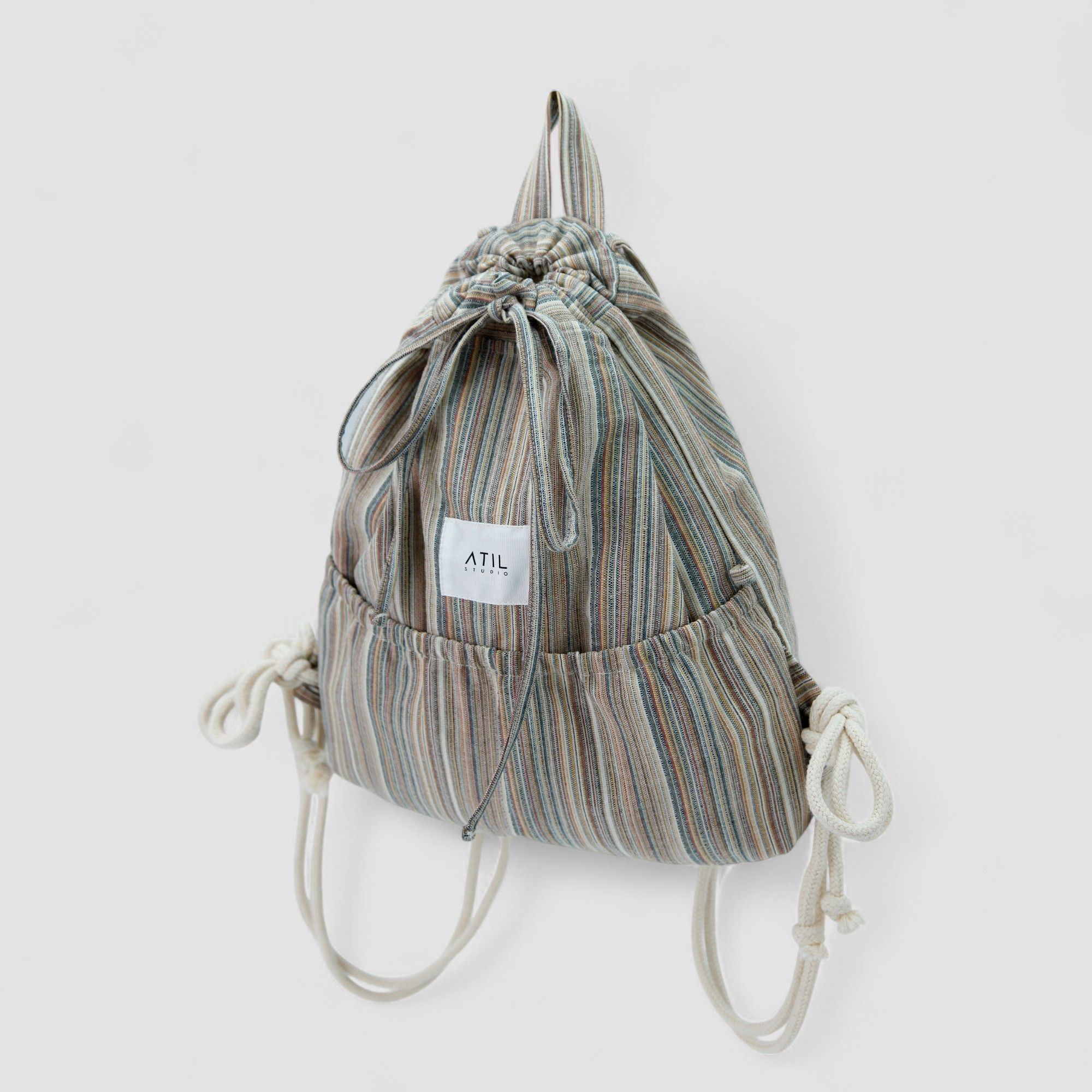 MUSINSA公式 | ATIL STUDIO Stripe Dune Drawstring Backpack_[Beige]