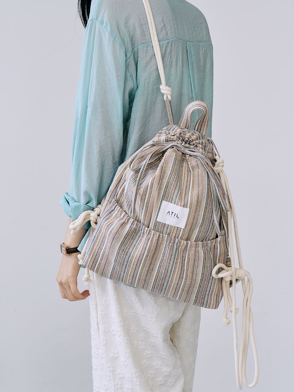 MUSINSA公式 | ATIL STUDIO Stripe Dune Drawstring Backpack_[Beige]
